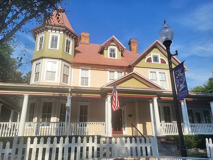 The historic home's architectural details and American flag create a picture-perfect setting for traditional afternoon tea.