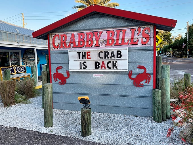Crabby Bill's welcoming exterior glows with warm light as evening falls, inviting seafood lovers to continue their feast well into the night.