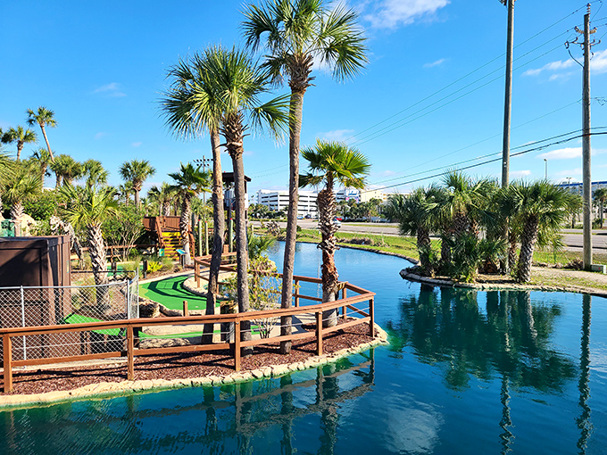 Palm trees frame the winding waterways of the mini-golf course, where putting perfection meets tropical paradise.