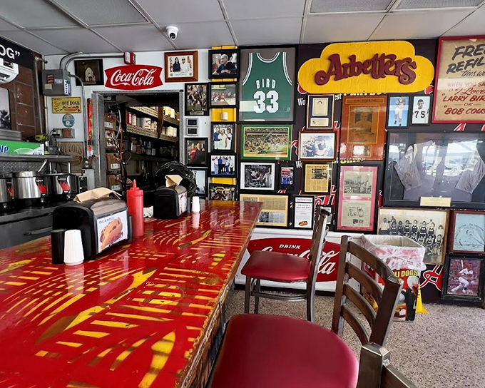 The bar area at Arbetter's tells stories through memorabilia &ndash; each jersey, photo, and sign a chapter in Miami's culinary history.