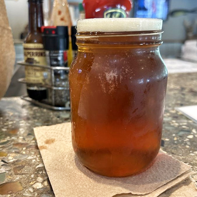 Amber liquid catches light in a mason jar, condensation beading like morning dew &ndash; the perfect companion to Gulf Coast seafood treasures.