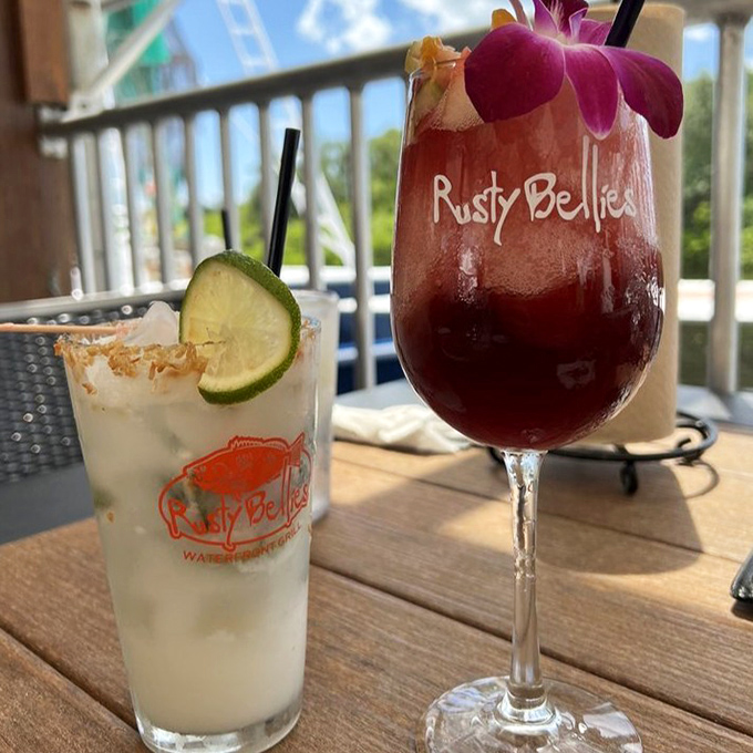 Tropical drinks at Rusty Bellies don't just quench your thirst; they transport you to vacation mode faster than any airplane ever could.