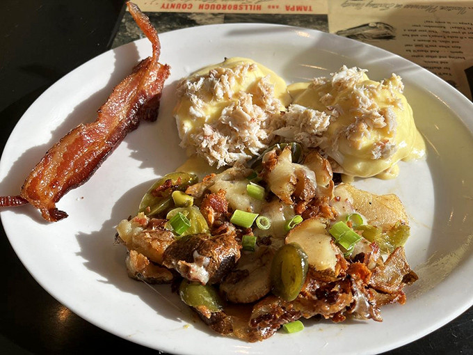 Crab eggs Benedict with loaded home fries – where coastal luxury meets diner comfort in a plate-licking symphony of flavors.