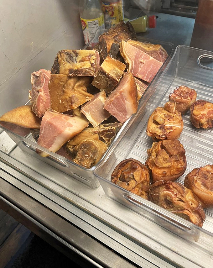 Country ham hocks and bacon ends sit proudly in their smoky glory &ndash; essential ingredients for transforming ordinary beans into Southern ambrosia.