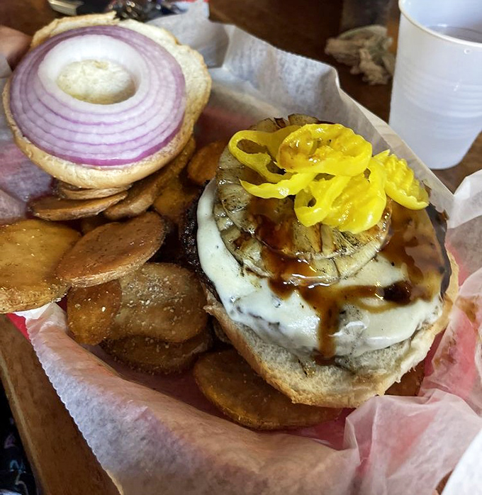 Paradise between buns! This tropical-inspired burger pairs juicy beef with grilled pineapple and comes with perfectly golden homemade chips.
