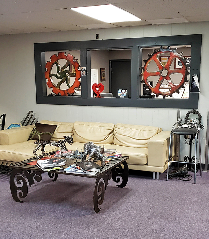 The gallery's interior showcases how industrial materials transform into art – where gears and metal find their second act as masterpieces.