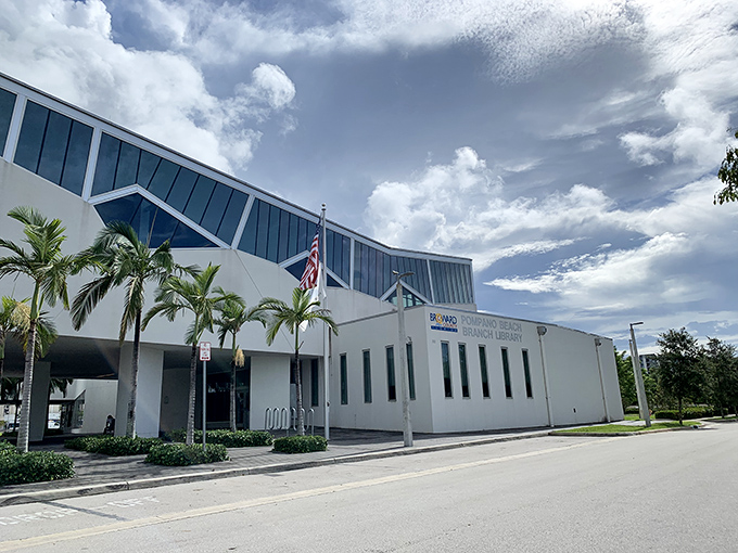 The library stands as a modern temple of knowledge, its architecture as inviting as the worlds waiting to be discovered within its pages.