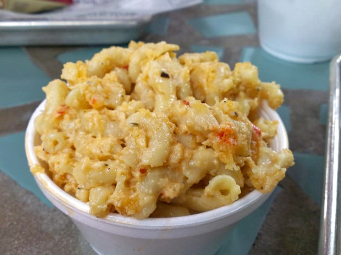 This isn't your ordinary mac and cheese &ndash; it's a creamy, decadent affair studded with lobster and artichoke that might make you momentarily forget about the pulled pork.