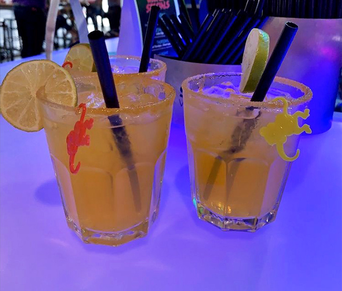 Margaritas arrive in substantial glasses rimmed with salt, providing the perfect refreshment after a round of arcade games.