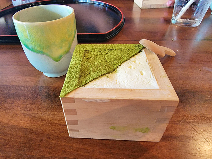Creamy matcha tiramisu arrives in a wooden box, blending soft sweetness with earthy green tea.