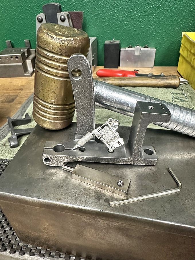 The brass, springs and metal components of vintage tattoo equipment reveal the industrial craftsmanship behind body art.