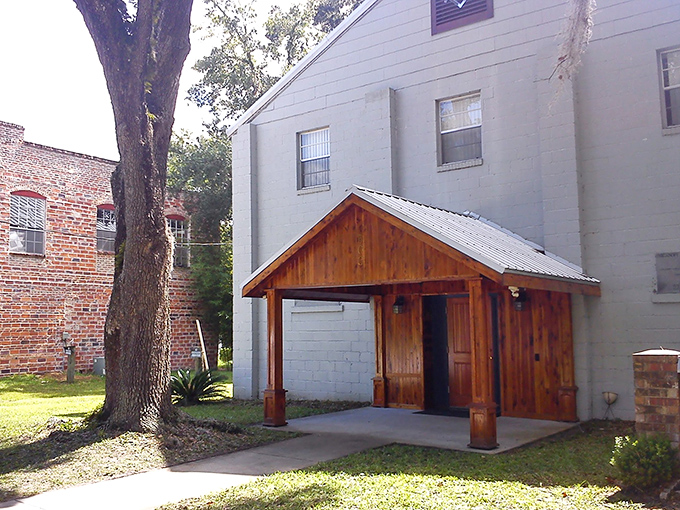 Micanopy's Masonic Lodge presents a humble yet dignified facade, its wooden entrance hinting at generations of community fellowship within.
