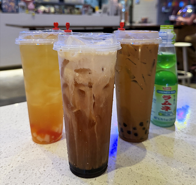 Milk tea that's dressed to impress with boba pearls playing hide and seek at the bottom &ndash; each sip is like a sweet plot twist.