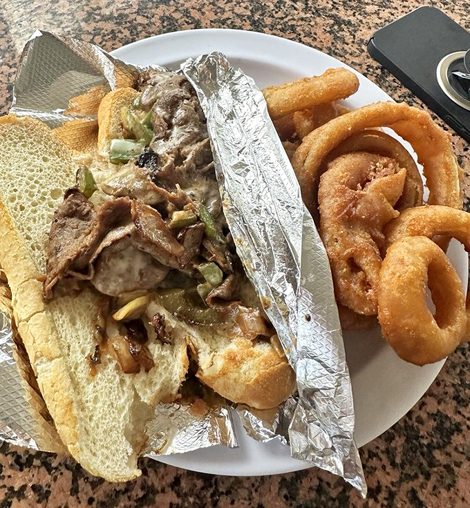 Wheeler's Philly cheesesteak doesn't mess around &ndash; tender beef, melted cheese, and grilled peppers and onions spilling out of a soft roll.