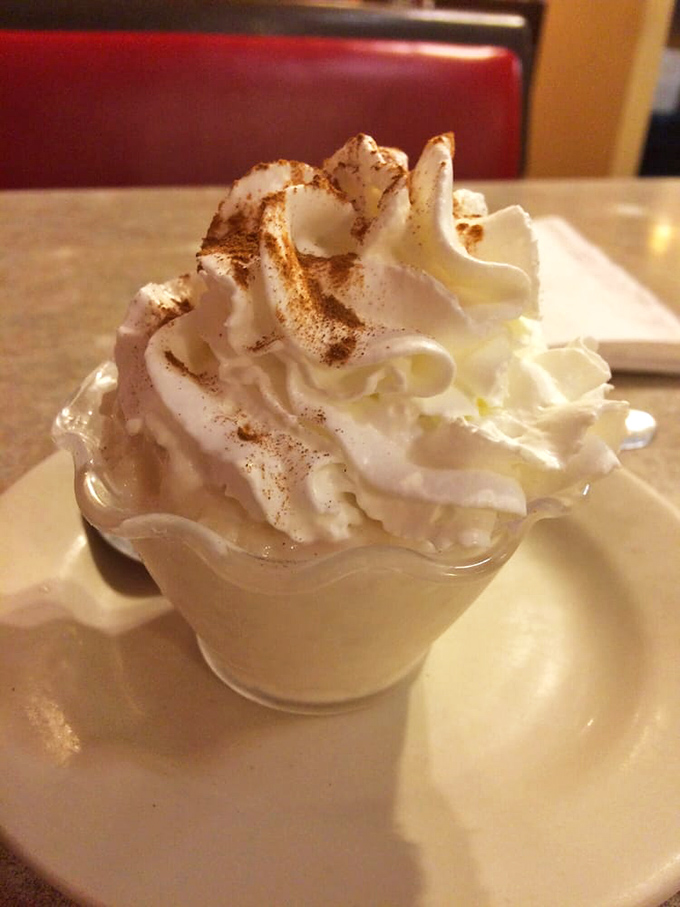 Creamy comfort in a cup, topped with a cloud of whipped cream and a sprinkle of cinnamon that whispers, "Diet? What diet?"
