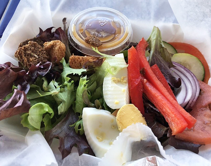 A colorful assembly of fresh vegetables offering a crisp counterpoint to the seafood symphony, proving greens have a place at this feast.