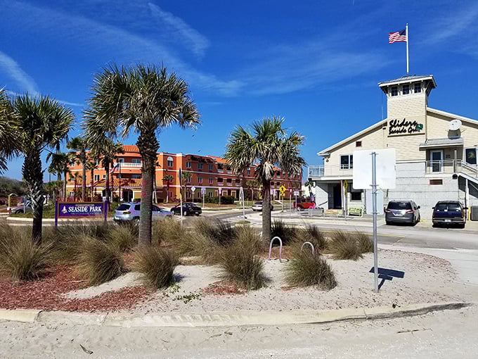 Seaside Park provides a perfect vantage point for watching boats navigate the harbor, with colorful buildings creating a postcard-worthy backdrop.