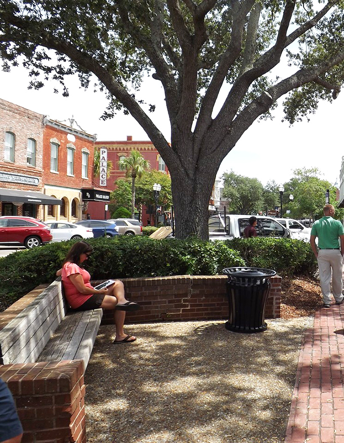 These Adirondack chairs aren't just seating – they're invitation stations for watching the world amble by at island pace.