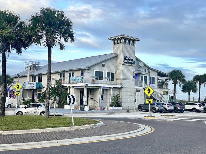 Sliders Seaside Grill offers prime sunset-watching real estate where beach vibes and comfort food create the perfect coastal cocktail.