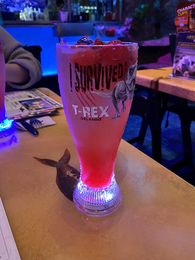 "I Survived T-REX" isn't just a statement, it's a glowing strawberry lemonade that serves as both refreshment and souvenir.