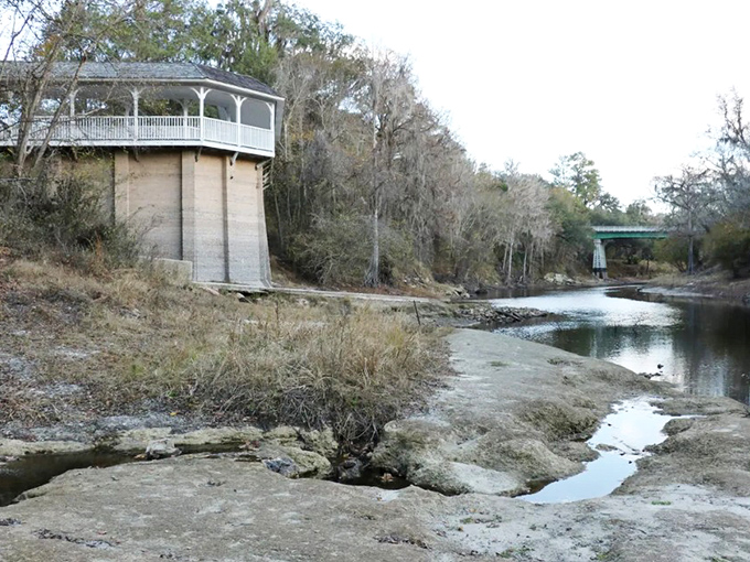 The elegant bathhouse perches on the Suwannee River bank, its reflection rippling in waters made famous by Stephen Foster.