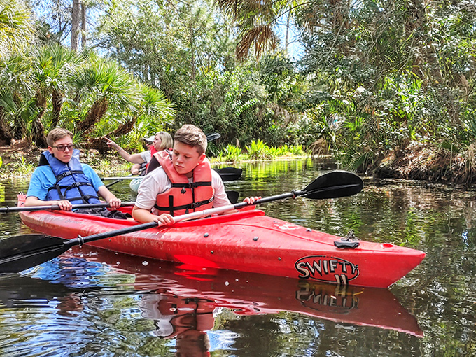 Serenity on the water – young explorers paddle through crystal-clear waters, discovering the zoo's habitats from a duck's perspective.