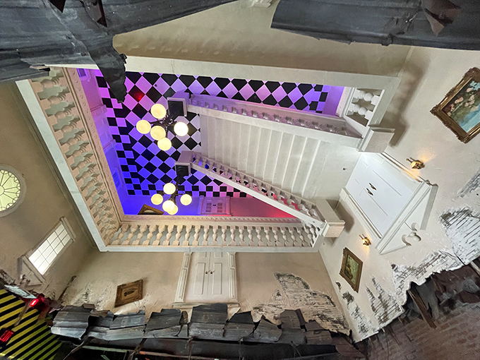 The interior continues the upside-down theme with furniture clinging to the ceiling, making you wonder if Spider-Man designed the place during a creative phase.