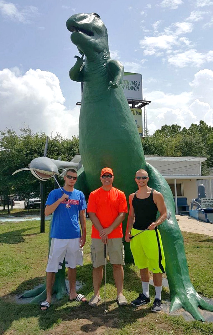 Visitors pose with the legendary dinosaur, creating memories that will outlast even the sturdiest concrete creatures.