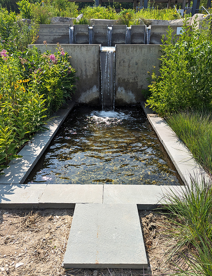 Water cascades down geometric steps, creating a meditative soundtrack while demonstrating sustainable water management with style.