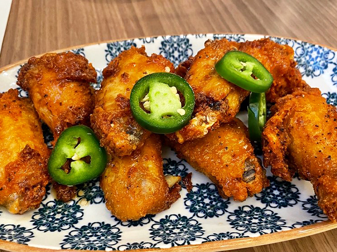 Crispy on the outside, juicy on the inside, these buffalo-sauced beauties with fresh jalapeño garnish prove that classics become classics for a reason.