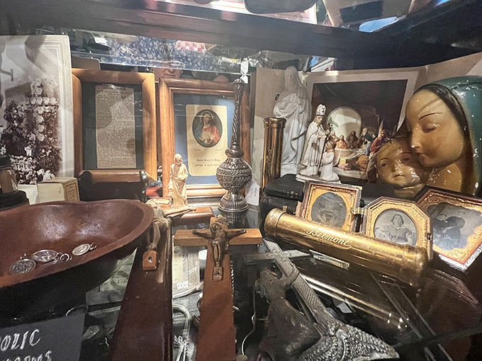 Religious artifacts and antique collectibles create a cabinet of curiosities that would make Victorian collectors swoon with envy.