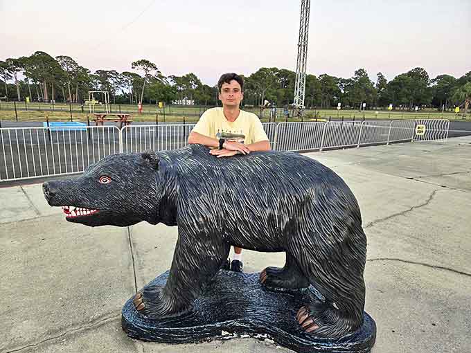 This stoic black bear statue has witnessed thousands of family photos, each featuring the same awkward pose.