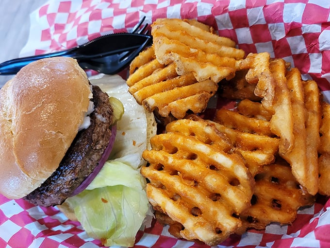 A proper burger with waffle fries proves that sometimes the classics don't need improvement, just proper execution and a side of nostalgia.