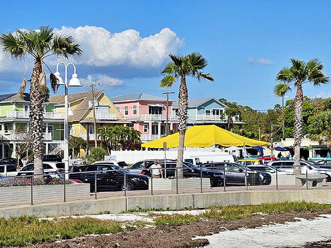Colorful buildings in sherbet hues line Gulfport's streets, where pastel-painted homes create a cheerful backdrop for the town's famous outdoor markets.