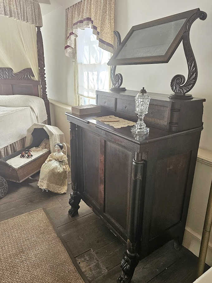 This ornate cabinet wasn't just furniture but a family's prized possession, displaying wealth and taste in an era before Instagram-worthy home d&eacute;cor.