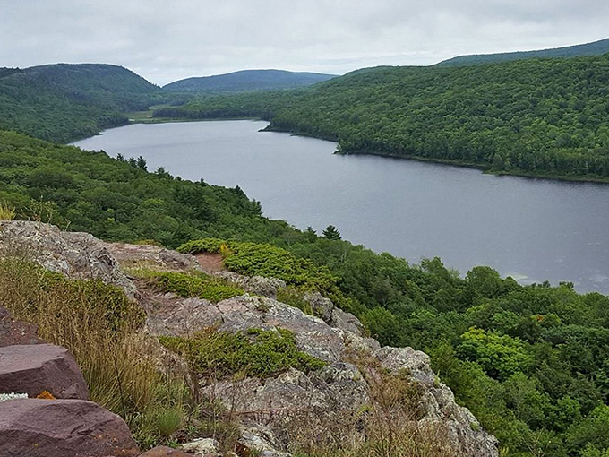 Dramatic cliffs stand sentinel over the valley, having witnessed the passing of ice ages with the patience only billion-year-old rocks can muster.
