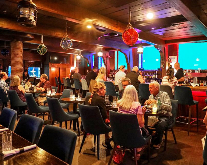 The evening crowd gathers in this maritime hideaway, where hanging lanterns cast a glow that makes everyone look like they've discovered buried treasure.