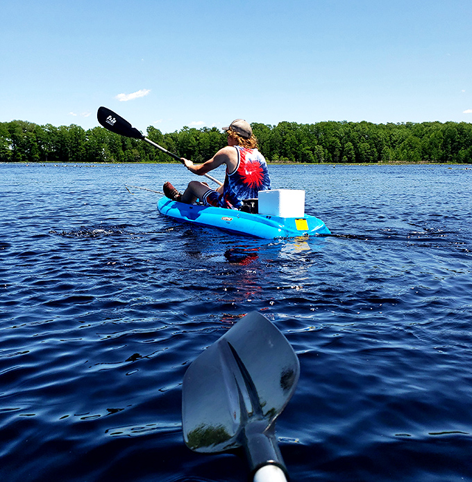Adventure awaits on blue waters &ndash; this paddler knows the joy of having the river to themselves, with only clouds for company.