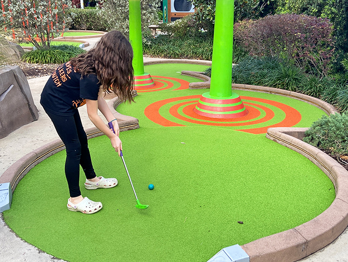 Concentration is key as young golfers discover that defeating aliens requires precision, patience, and perhaps a touch of beginner's luck.