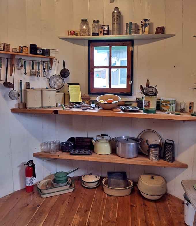 Period cookware and vintage kitchen items line the shelves, showing how meals were prepared when your kitchen was round and your house was famous.