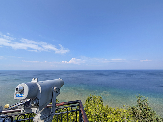 This vintage telescope invites visitors to become temporary explorers, scanning Lake Huron's vast blue horizon for maritime treasures.