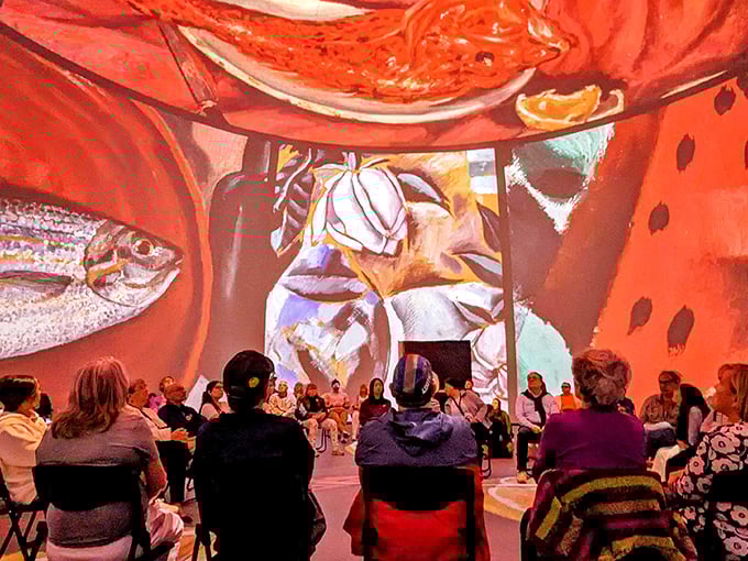 Art appreciation becomes a communal experience as visitors collectively gaze upward, necks craned in wonder at the surrealist feast unfolding above.
