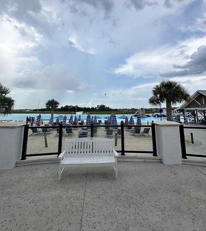 A peaceful bench overlooking turquoise waters &ndash; the perfect spot for contemplating life or just your next snack choice.
