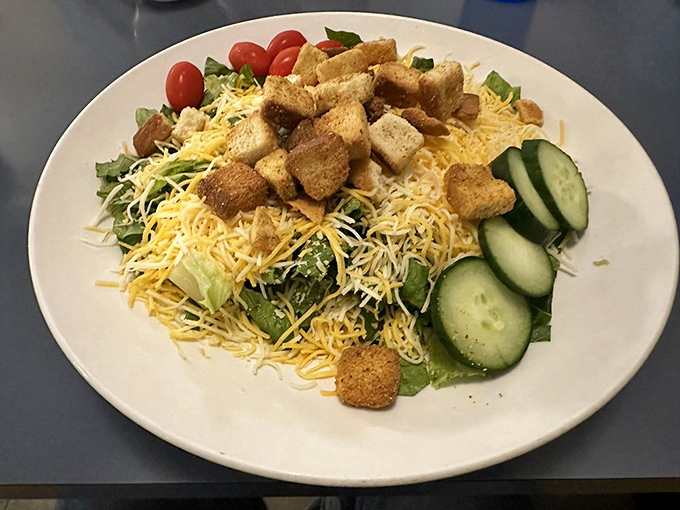 A garden-fresh salad that proves healthy eating doesn't have to be boring, piled high with crisp vegetables, cheese, and crunchy croutons.