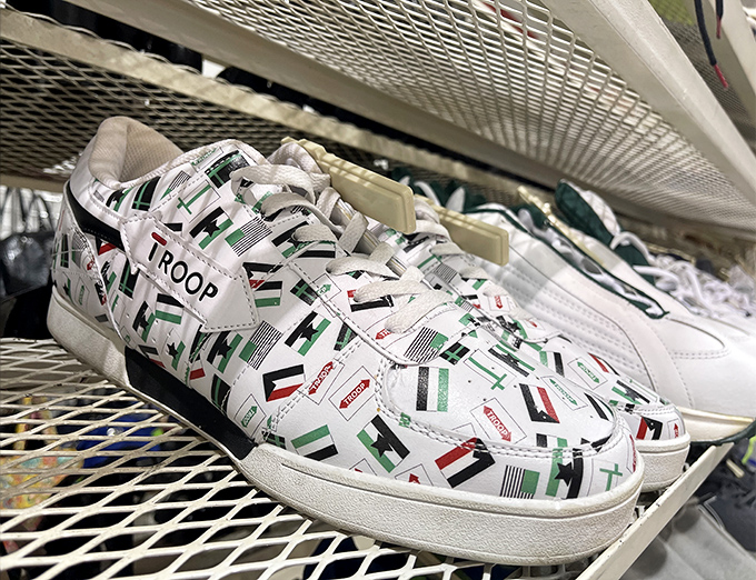 These aren't just sneakers – they're conversation starters with their unique flag-inspired pattern, waiting for the right feet to take them on new journeys.