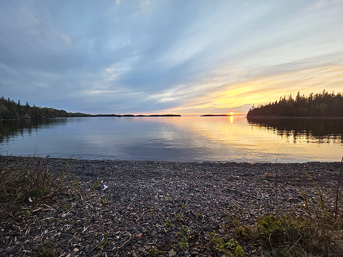 Lake Superior's sunset performance – where the sky and water compete for who can display the most spectacular color palette.