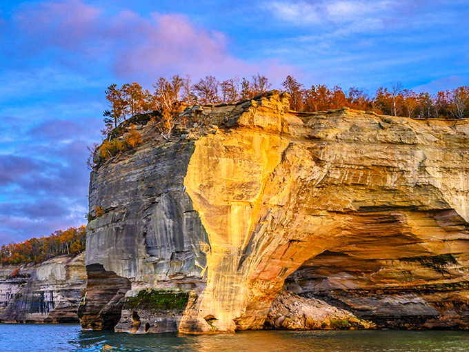 Sunset transforms ordinary rock into extraordinary art, as golden hour light illuminates millions of years of geological history.
