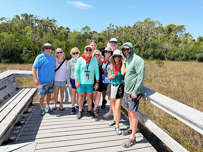 A group pauses to soak in the Everglades experience, proving that nature appreciation is best when shared with fellow adventurers.