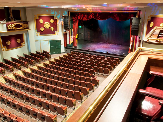 The auditorium's rich architectural details transport visitors to another era, where every ornate molding tells a story of craftsmanship.