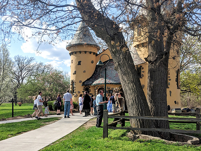 Curious visitors gather outside the castle doors, each about to discover the unexpected treasure that's been hiding in plain sight.